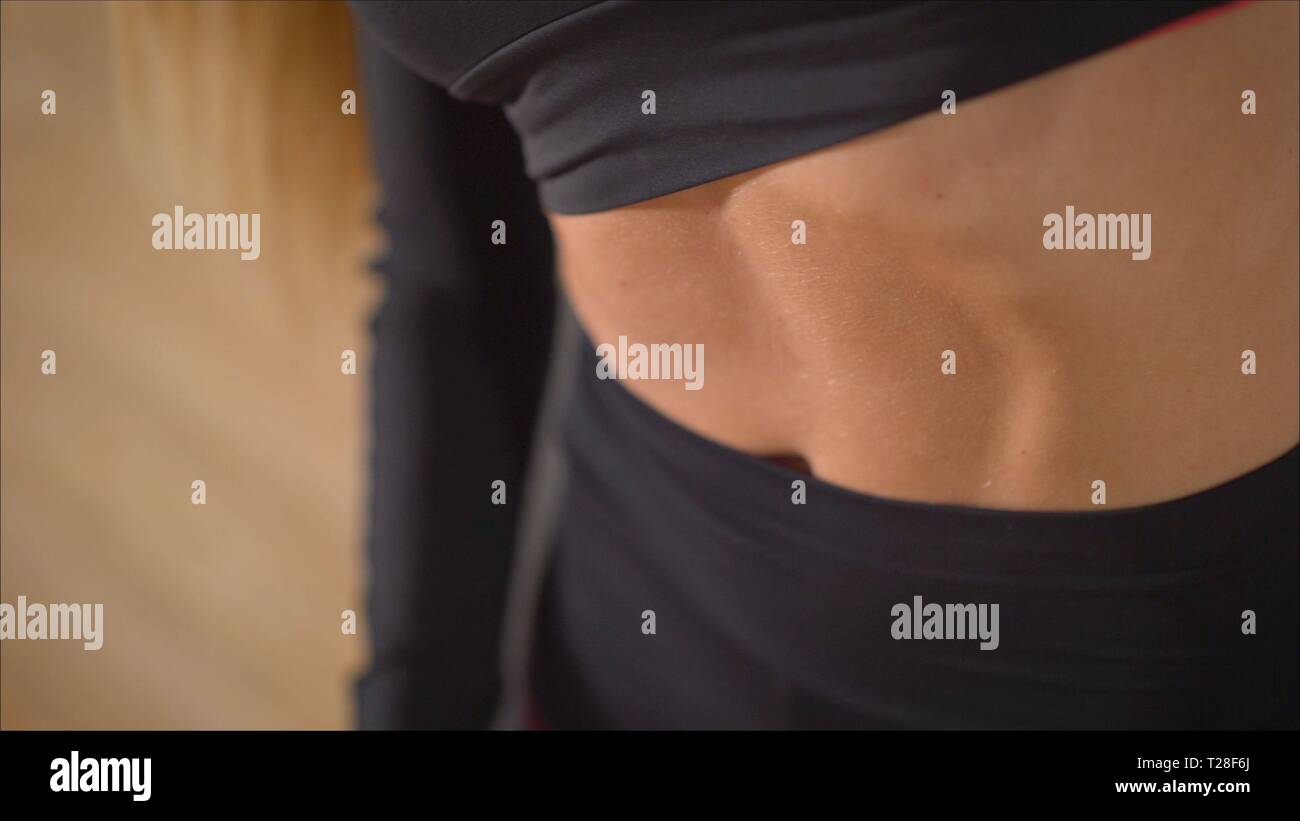 Woman doing exercises with fitball in fitness gym class. Engaging core ...