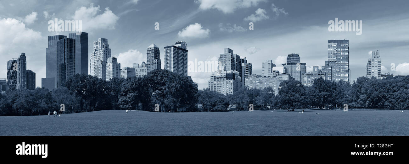 Central Park Spring with skyline in midtown Manhattan New York City ...