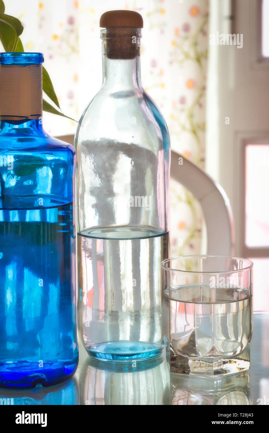 Glass and bottle of water Stock Photo - Alamy