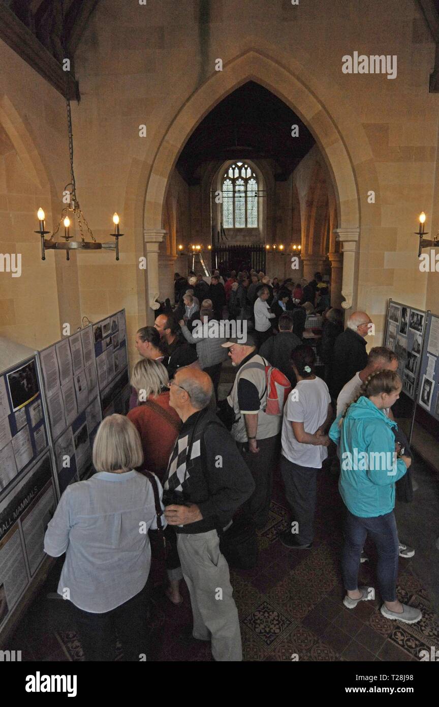 People looking at displays of the history of Imber church on Salisbury ...