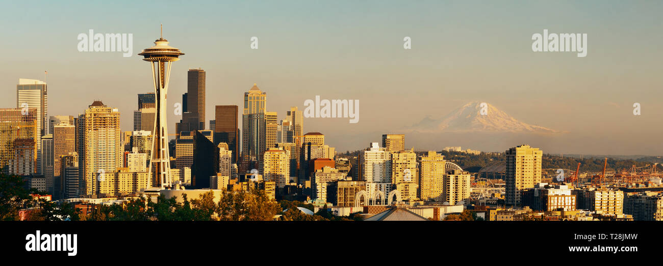Seattle city skyline with Mt Rainier at sunset with urban office ...