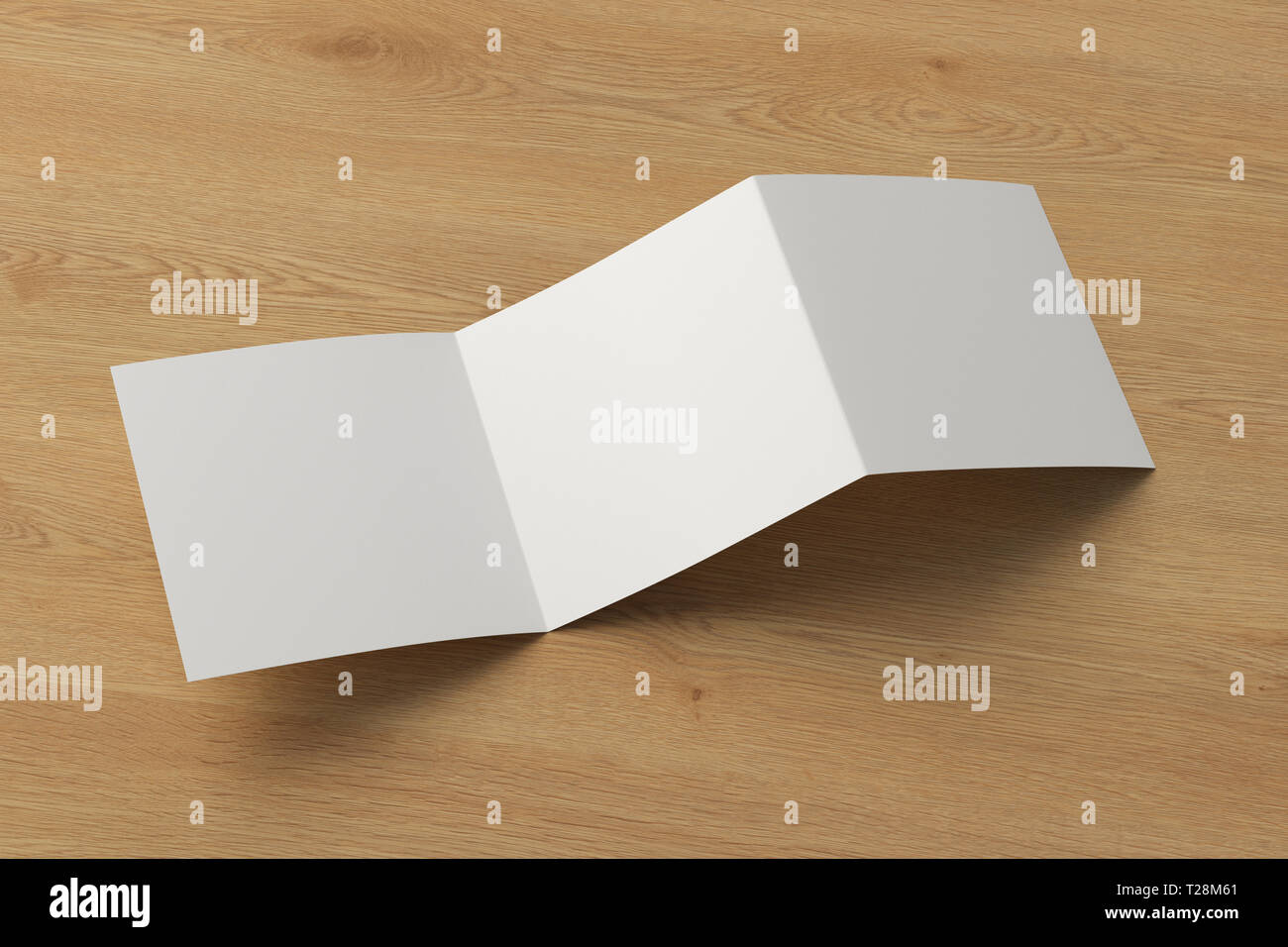 Blank trifold z-fold square brochure booklet on wooden background with ...