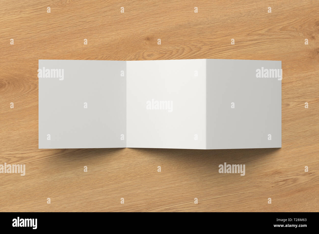 Blank trifold z-fold square brochure booklet on wooden background with ...