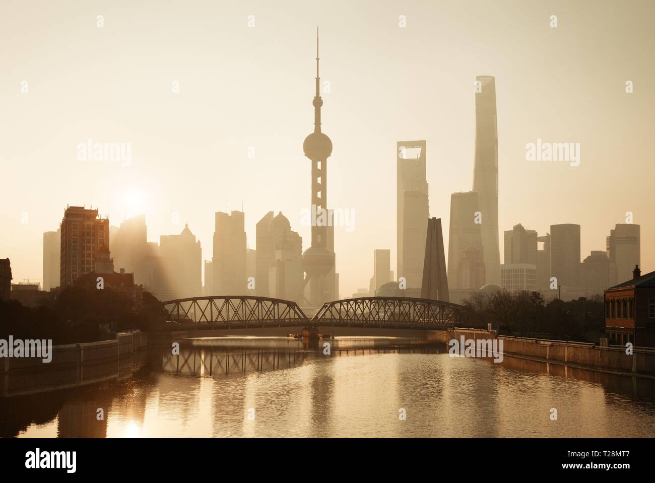 Shanghai morning with sunny sky and water reflections in China Stock ...