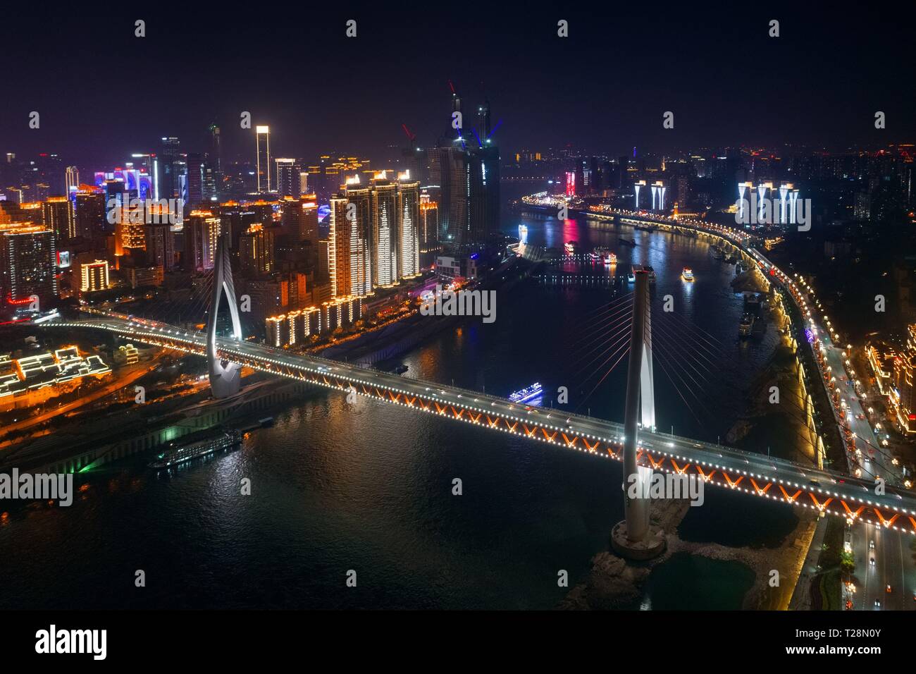 Aerial view of Bridge and city urban architecture at night in Chongqing ...