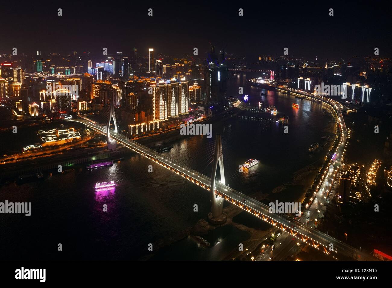 Aerial view of Bridge and city urban architecture at night in Chongqing ...