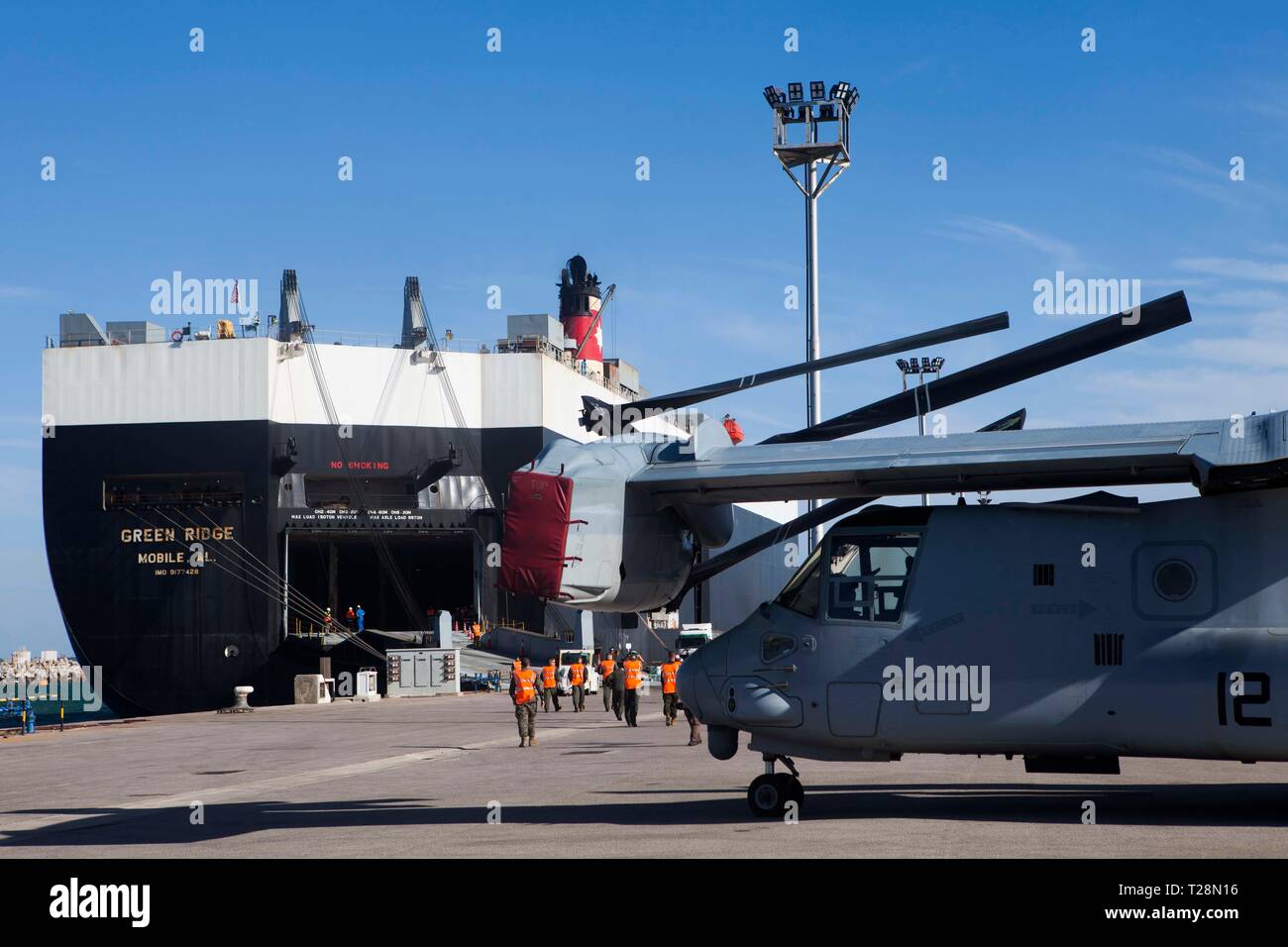 A U.S. Marine Corps MV-22B Osprey rests after being unloaded from the ...