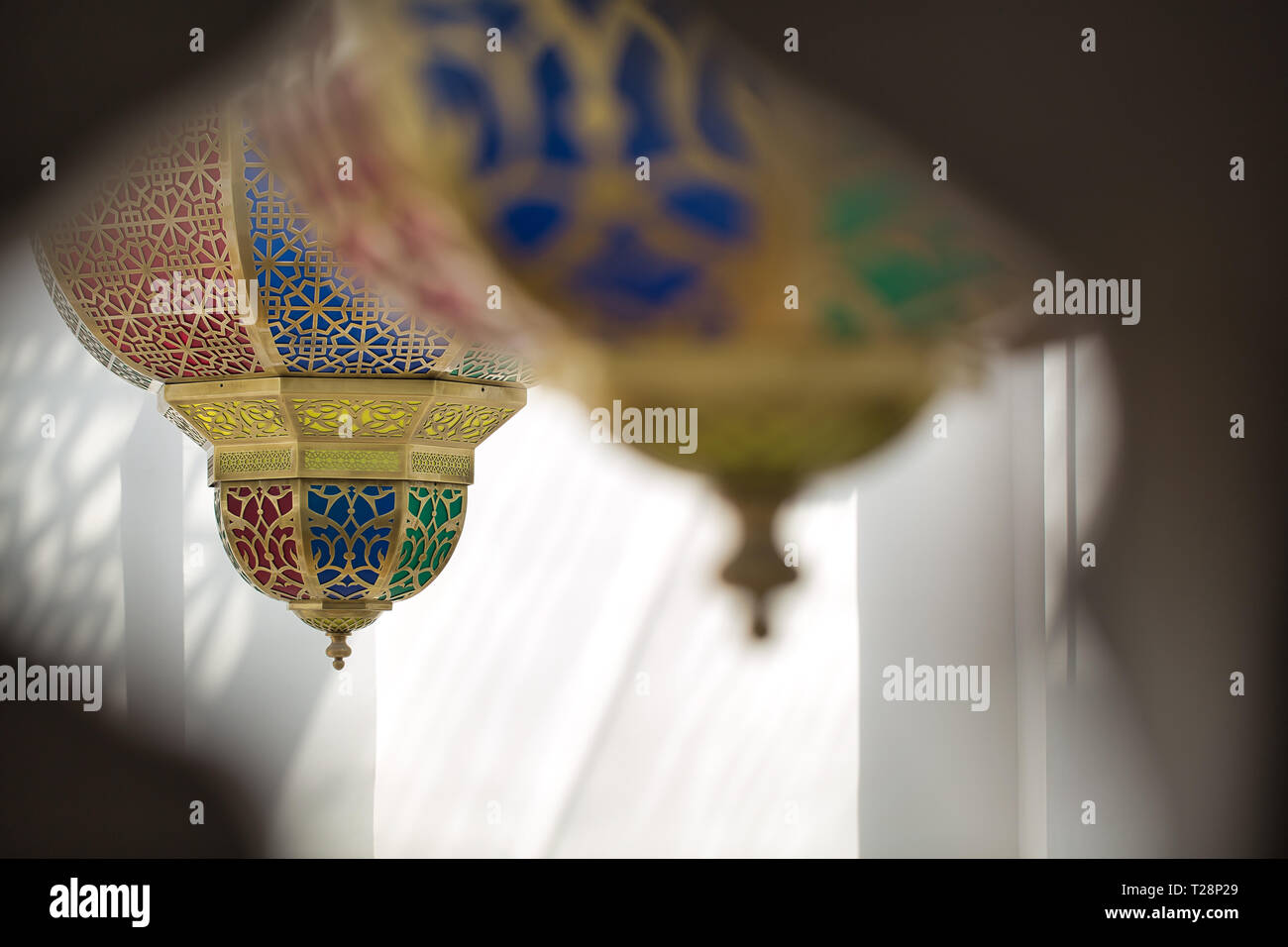 Peeking in between the terrace, looking at the chandelier Stock Photo ...