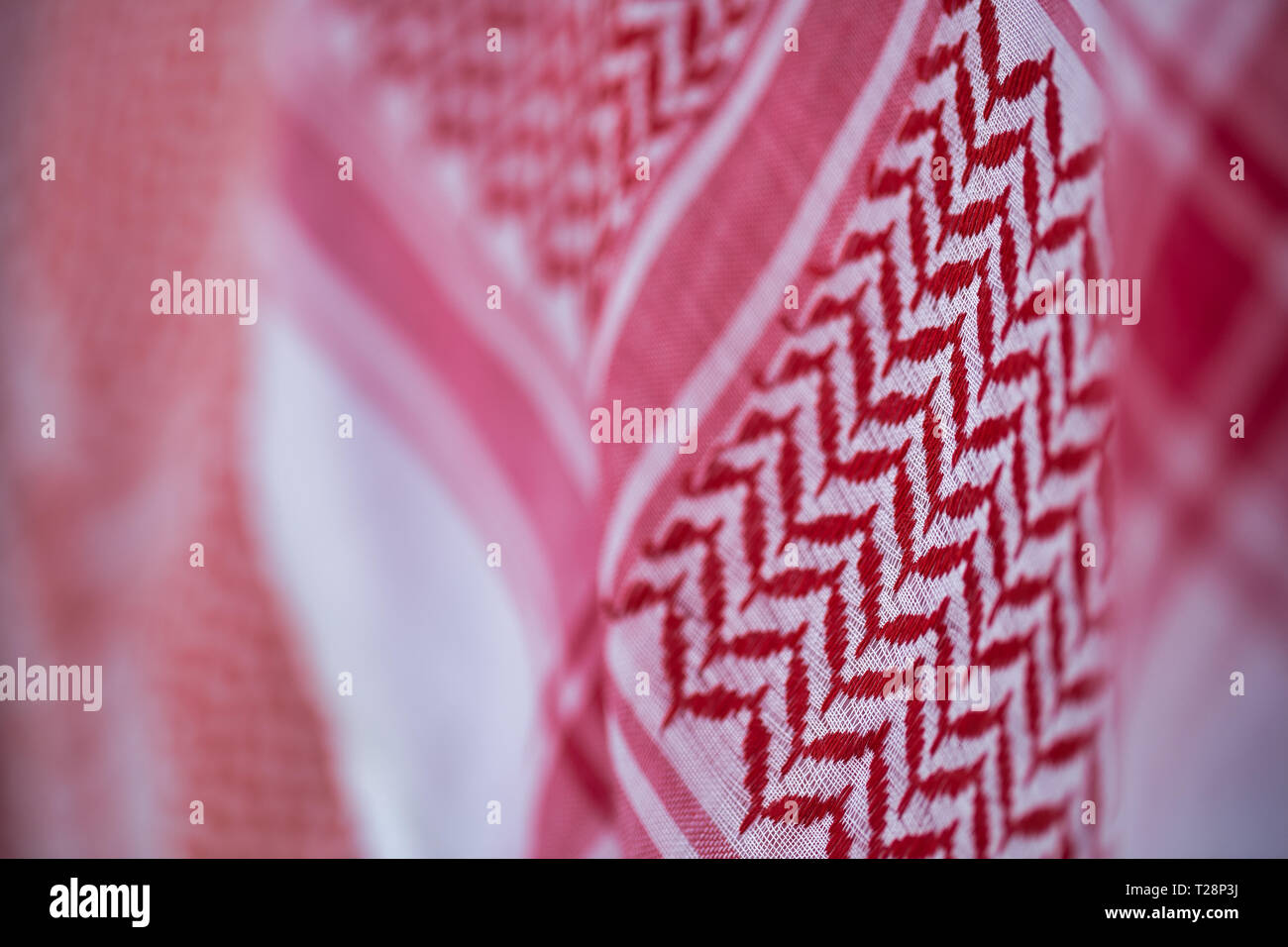 DOHA, QATAR - SEPTEMBER 22, 2014: Detail image of keffiyeh in middle ...