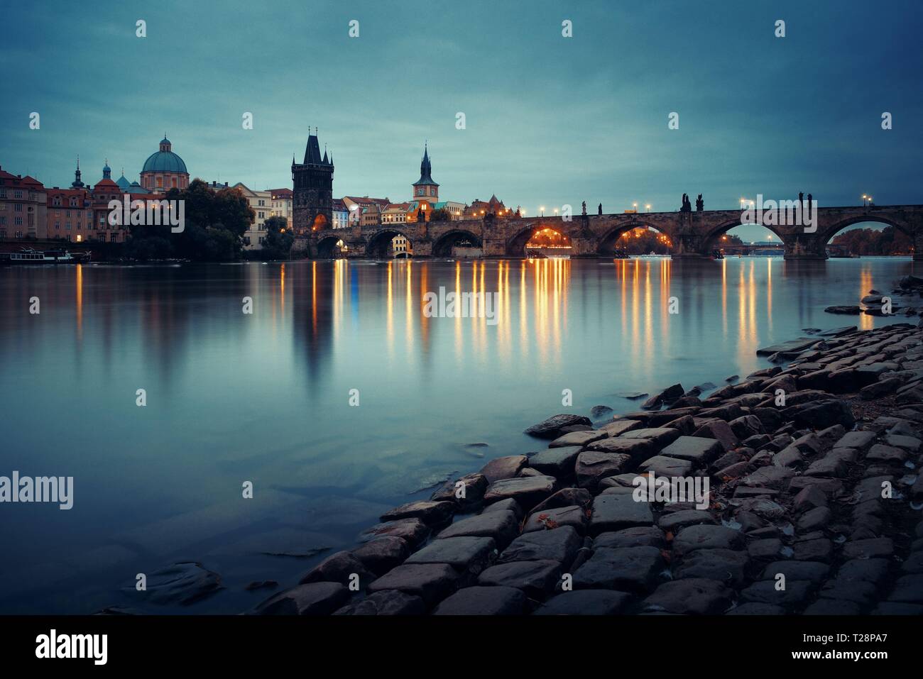 Prague skyline and bridge over river in Czech Republic at night Stock ...