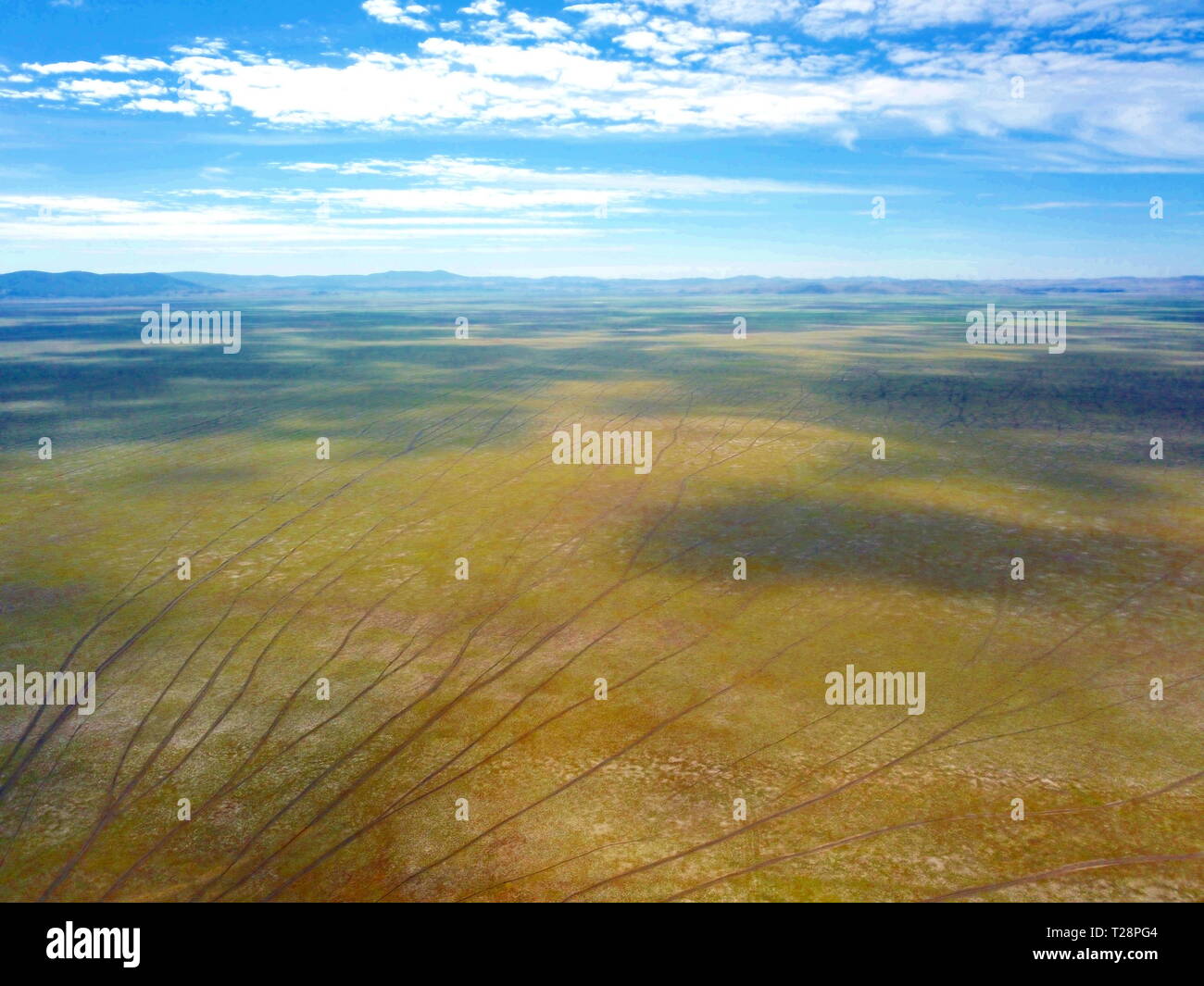 Empty Lake George nestled between a rural wind farm and farmland in ...