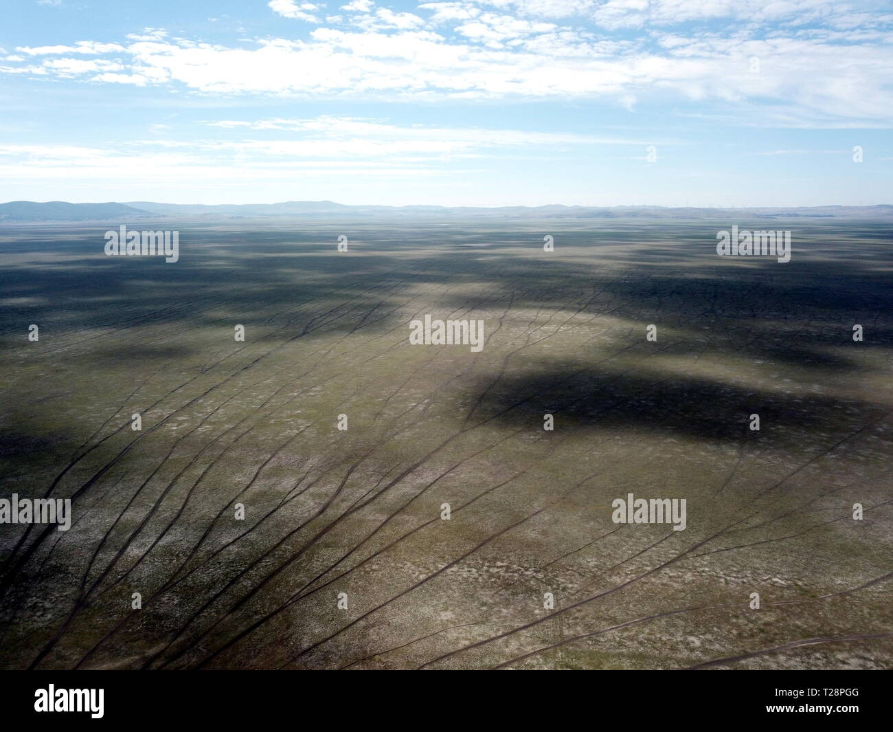 Empty Lake George nestled between a rural wind farm and farmland in ...