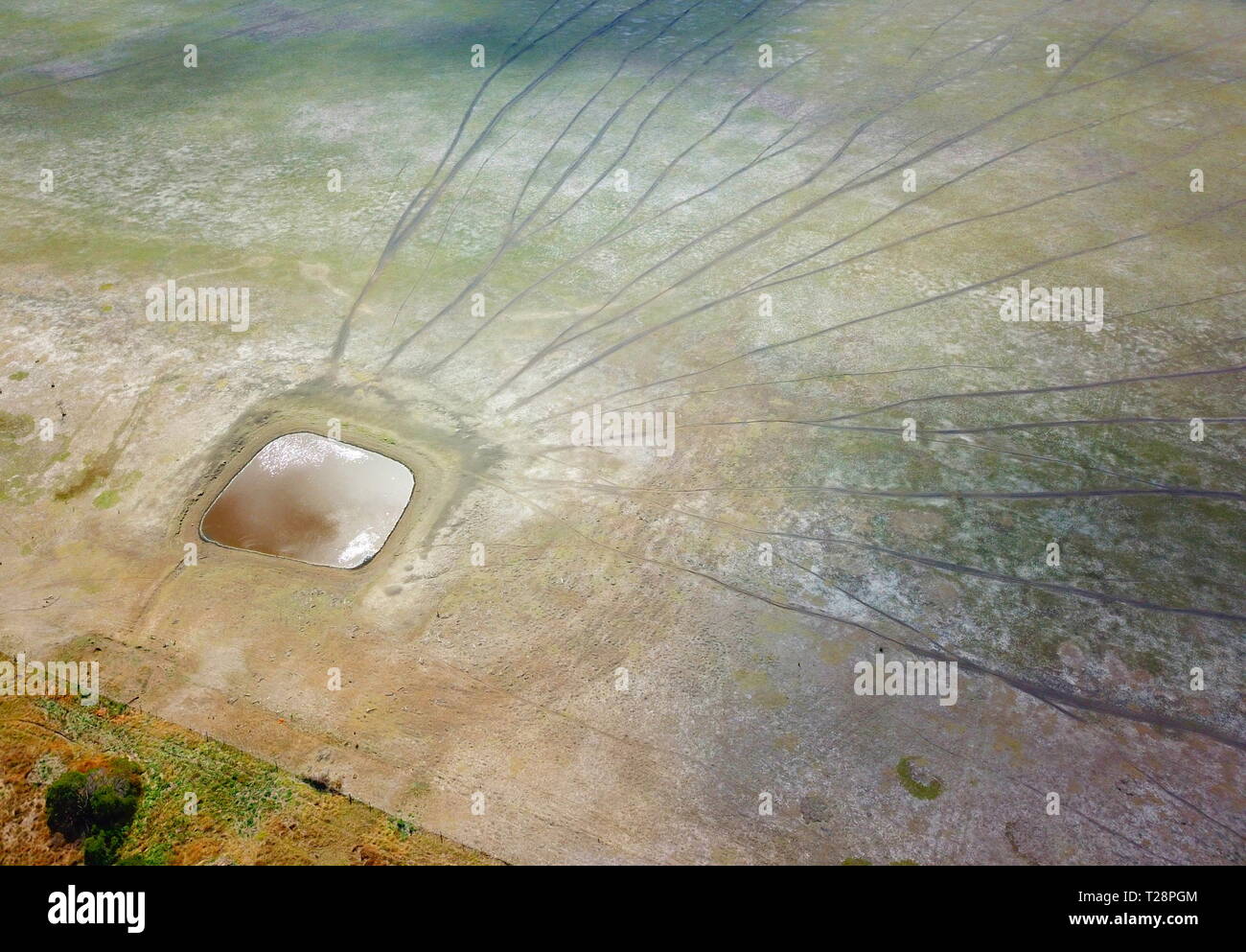 Empty Lake George nestled between a rural wind farm and farmland in ...