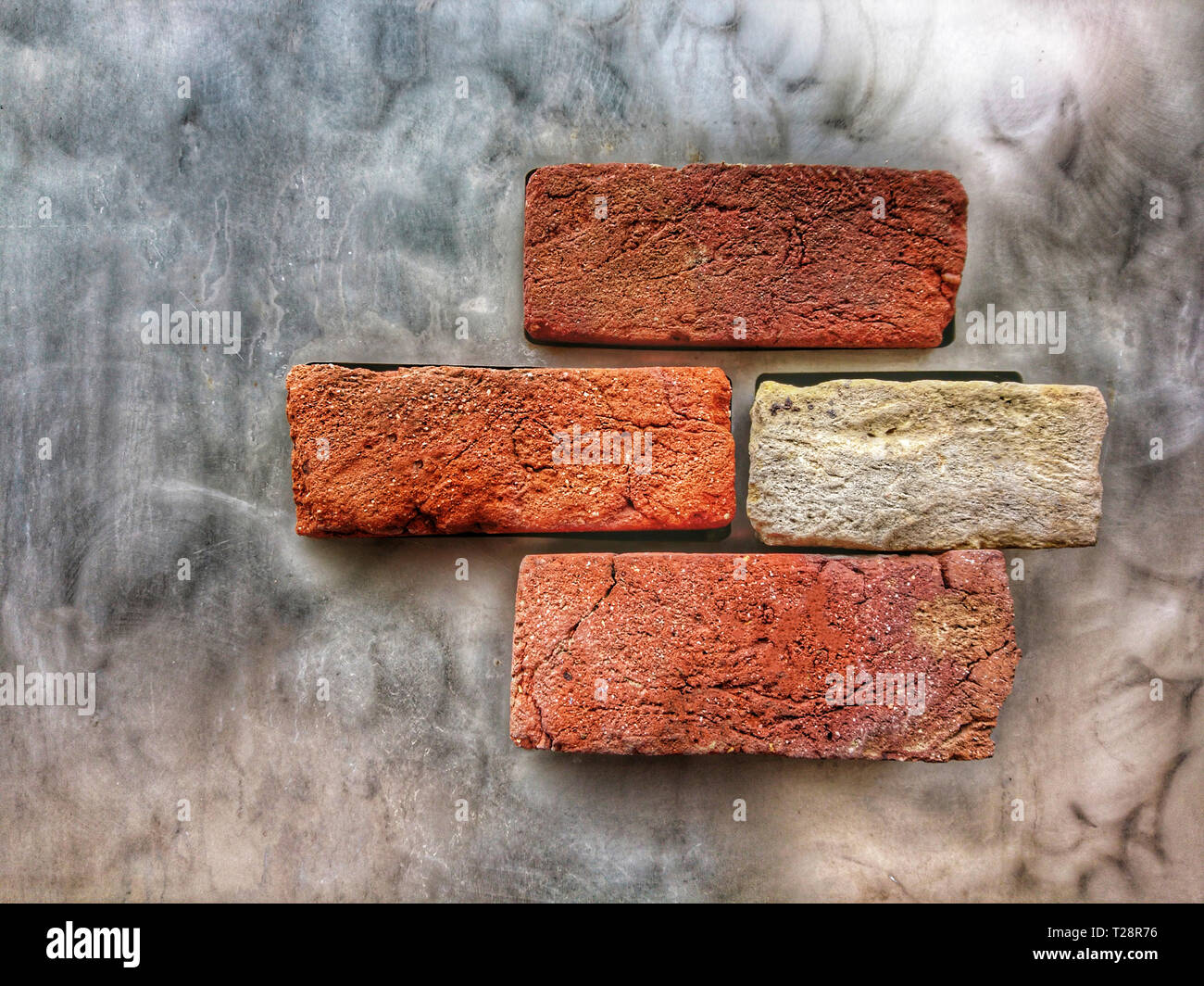 Four bricks on a marble base Stock Photo - Alamy