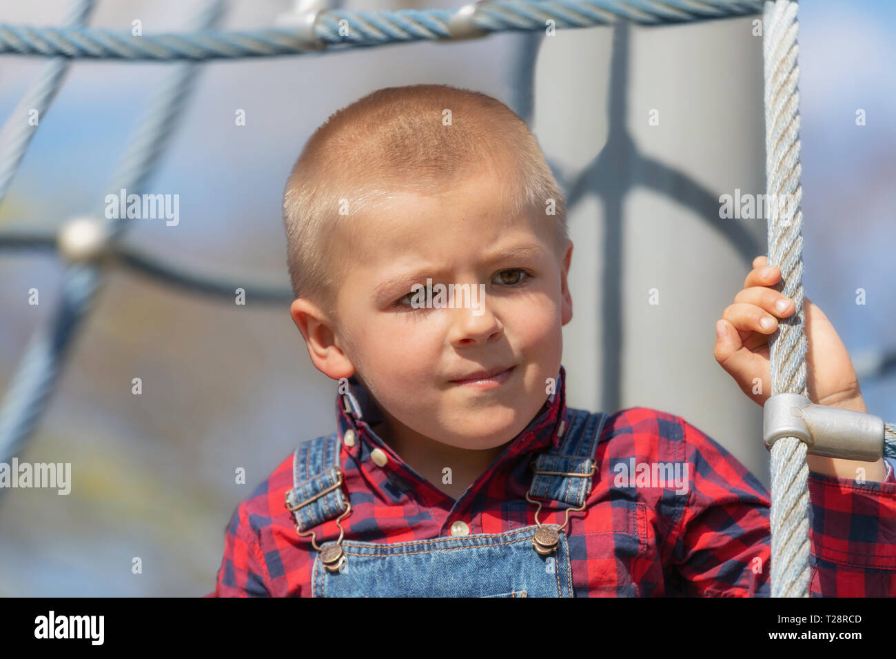 Fashion boy wearing checkered shirt Stock Photo - Alamy