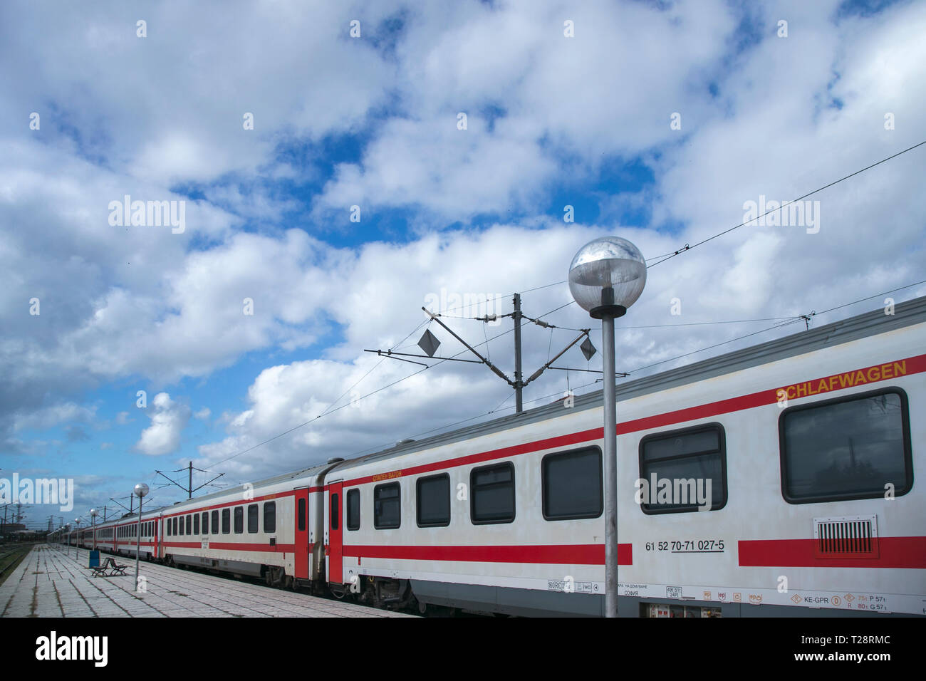 Train with wagons stopped at train station Stock Photo - Alamy