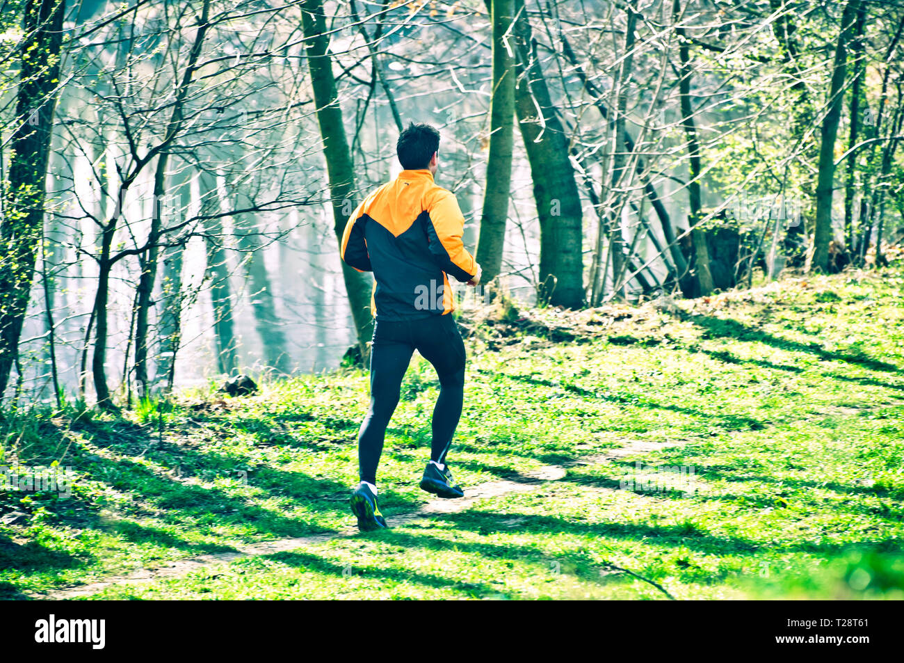 man running along a river Stock Photo - Alamy
