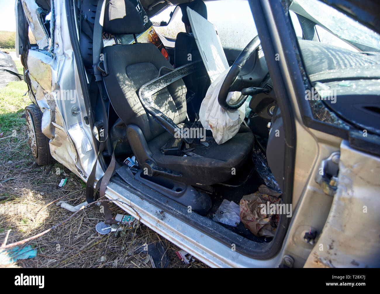 Mitsubishi Colt car wreck at the side of a quiet country road Stock ...