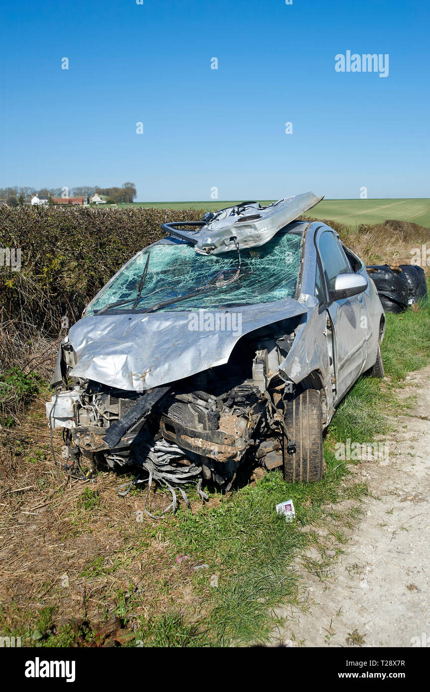 Mitsubishi Colt car wreck at the side of a quiet country road Stock ...