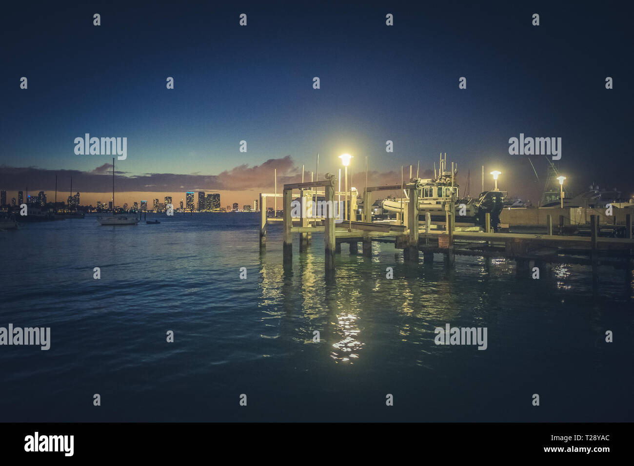 Pier overlooking Miami bay at night Stock Photo - Alamy