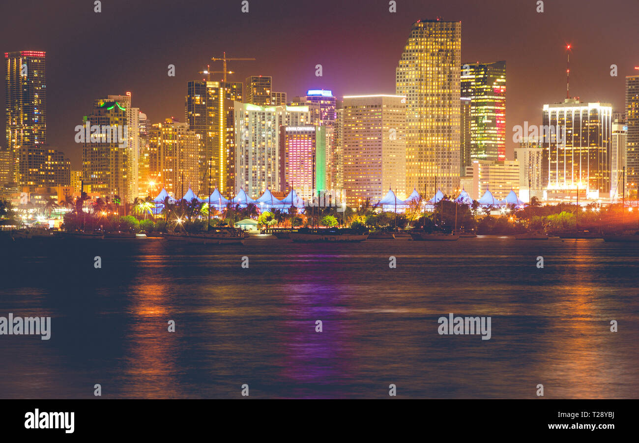 Night Scenery of Miami City Scape across the water. Neon lit ...