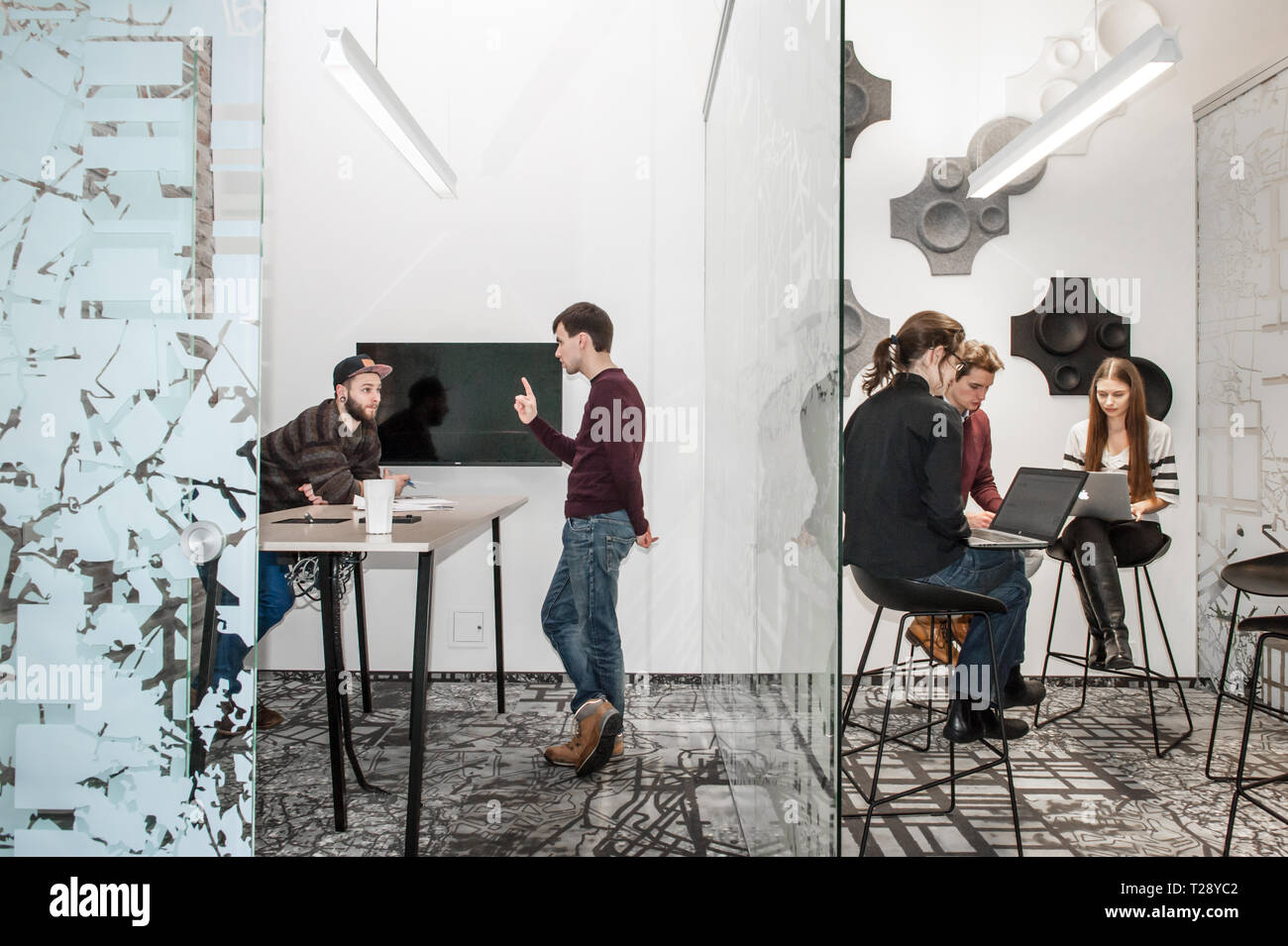 People engaged with technology in a business environment hi-res stock ...