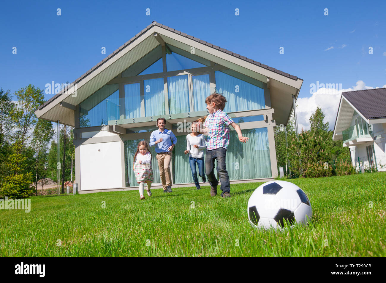 Family kids play soccer together hi-res stock photography and images ...