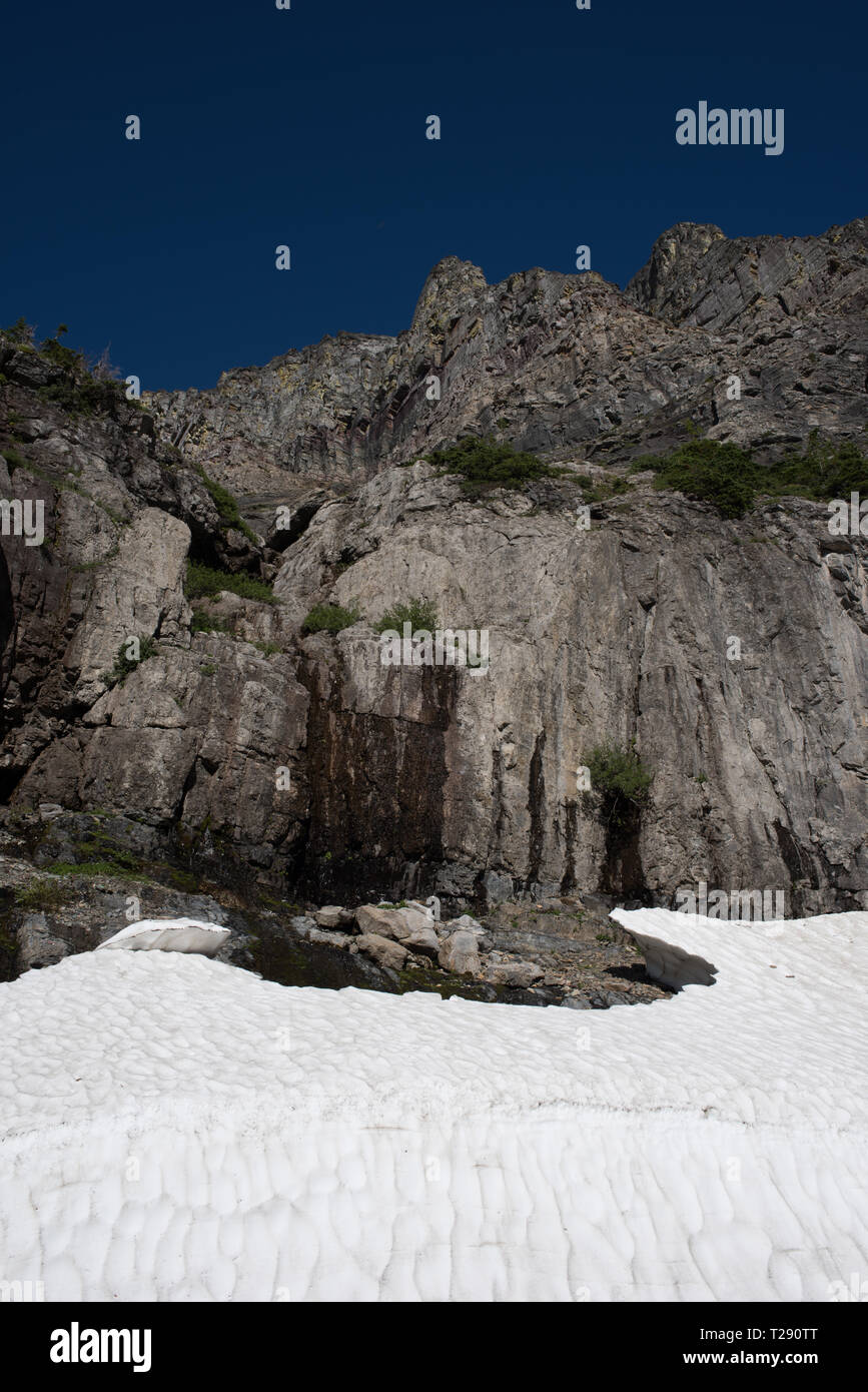 A snow bridge is a surprising find in the hot summer in Glacier ...