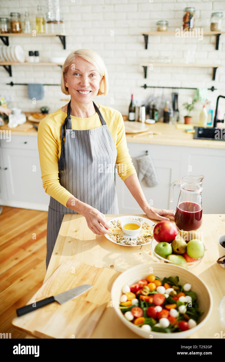 Happy woman in modern kitchen Stock Photo - Alamy
