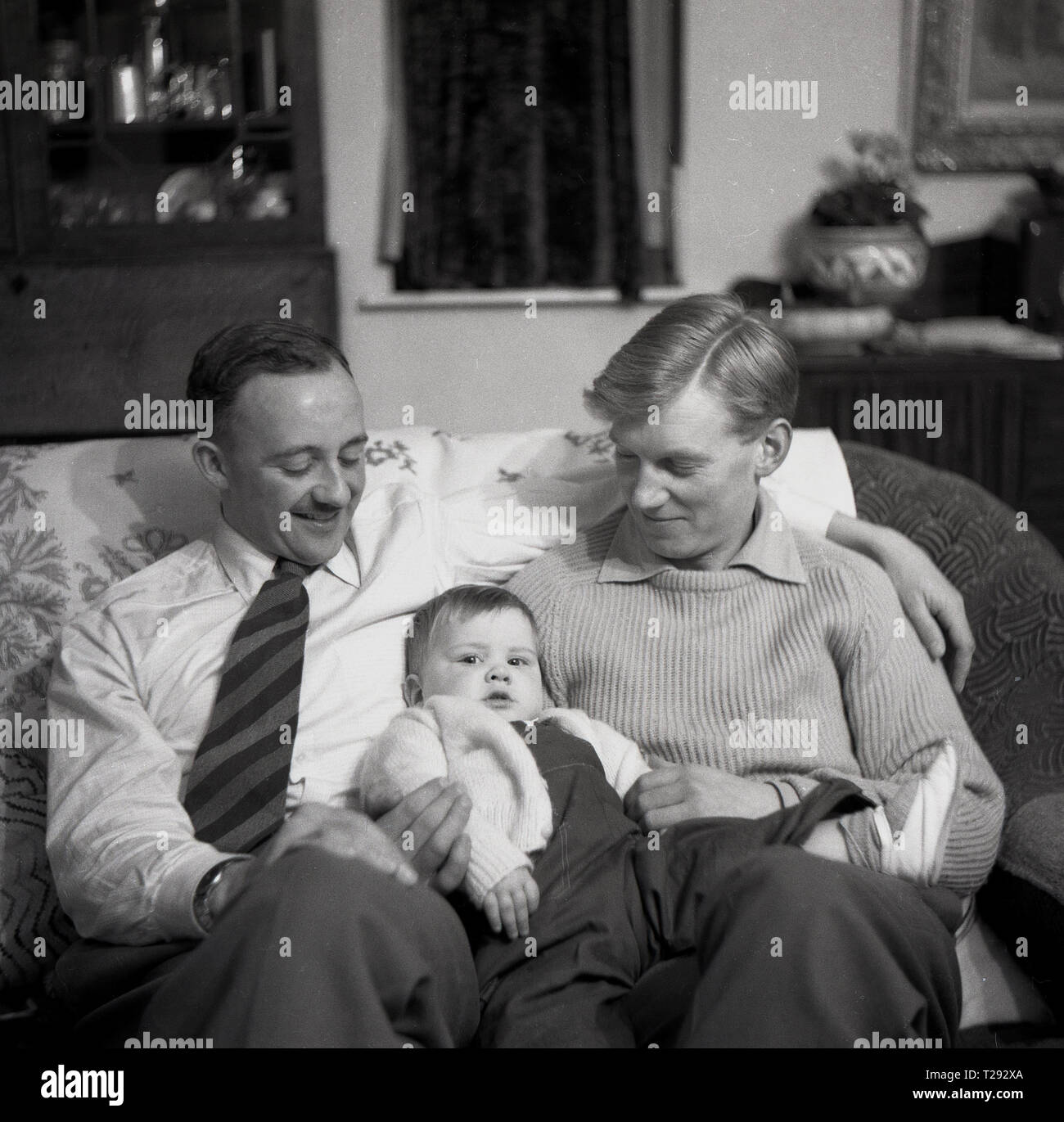 1950s, historical, Grandfather and young father with infant child ...