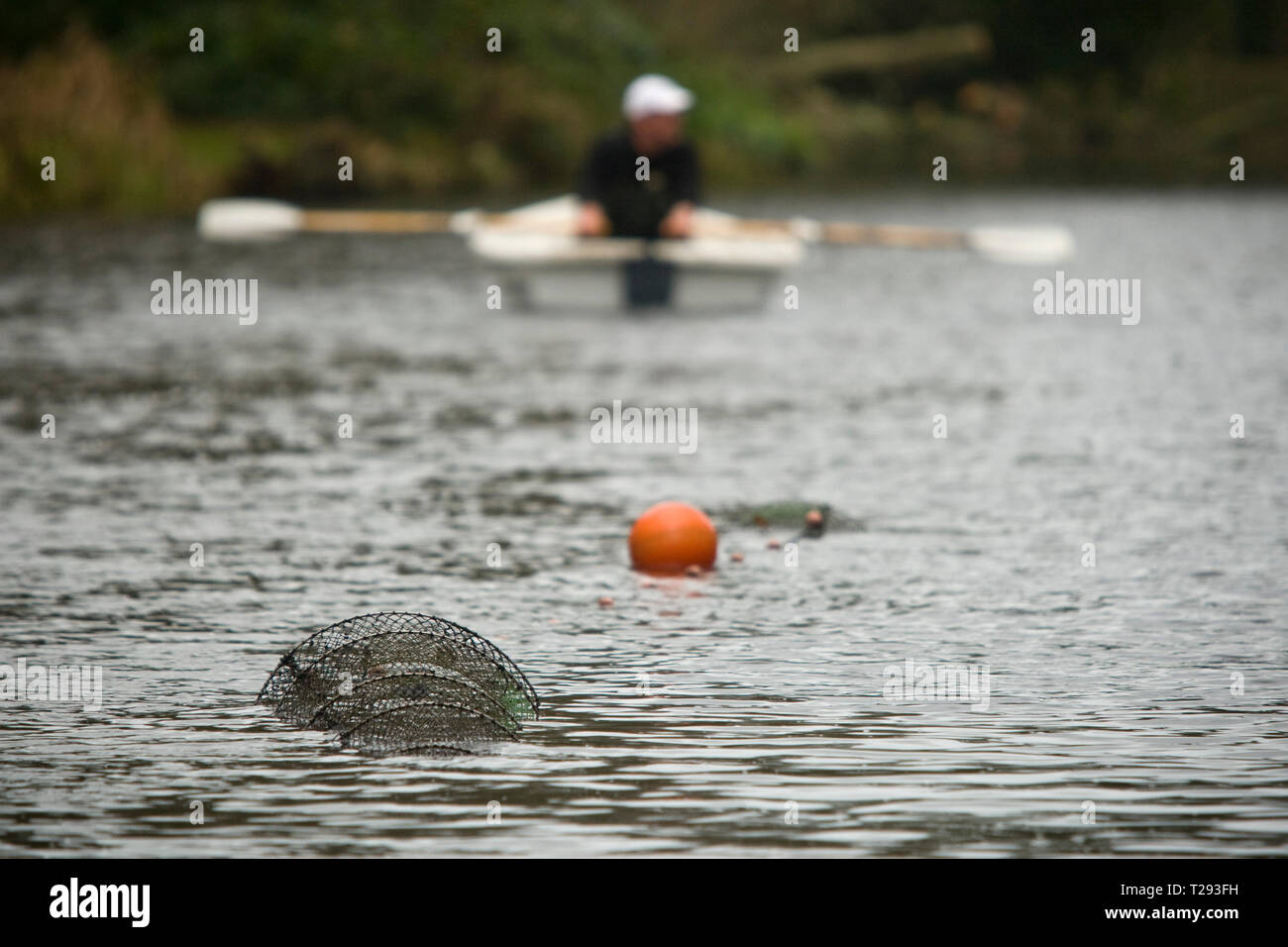 Fisherman David McCreadie rowing his small boat and away from a newly ...