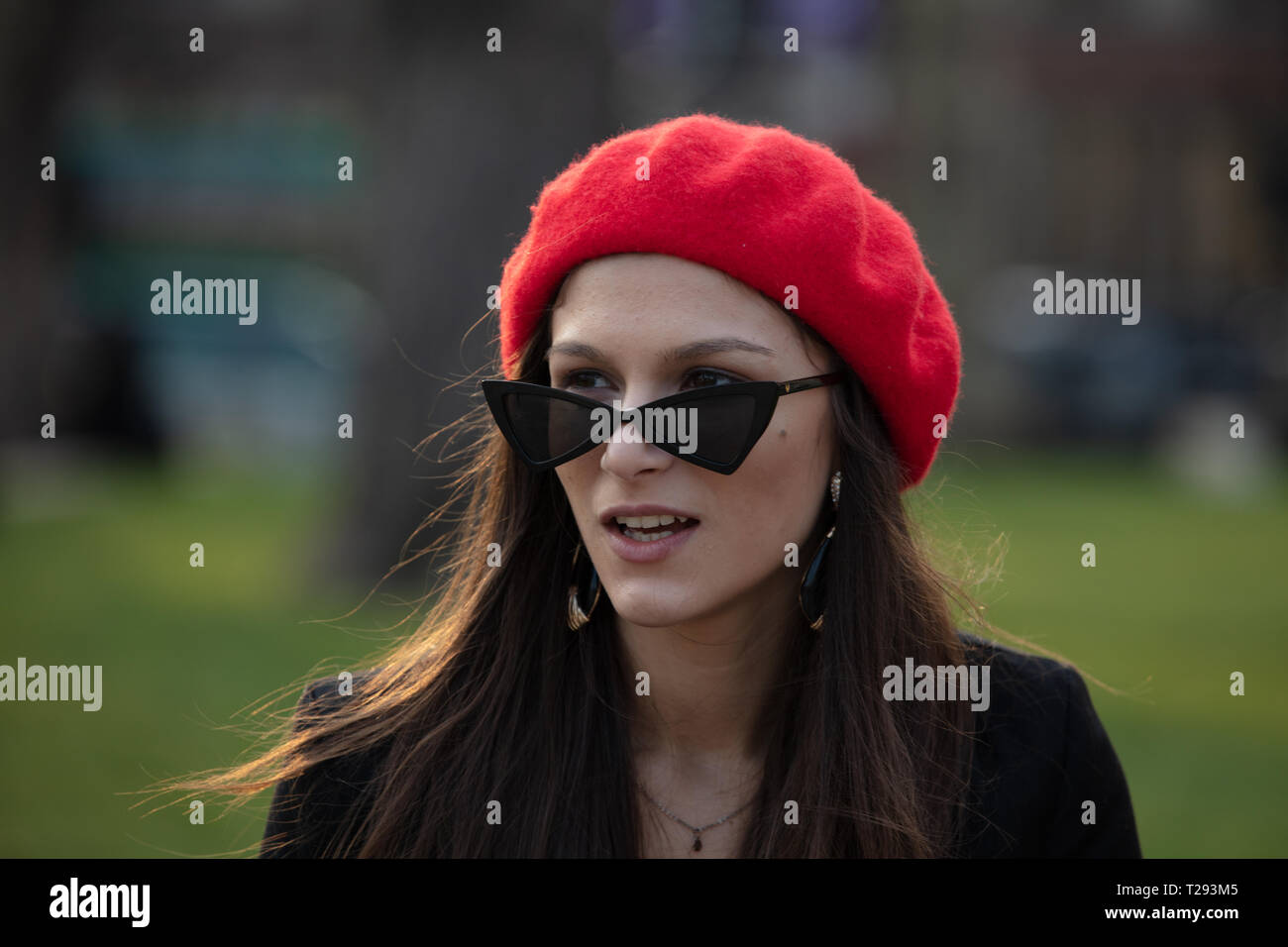 Portrait of a young fashionable and modern woman on Parliament Square ...
