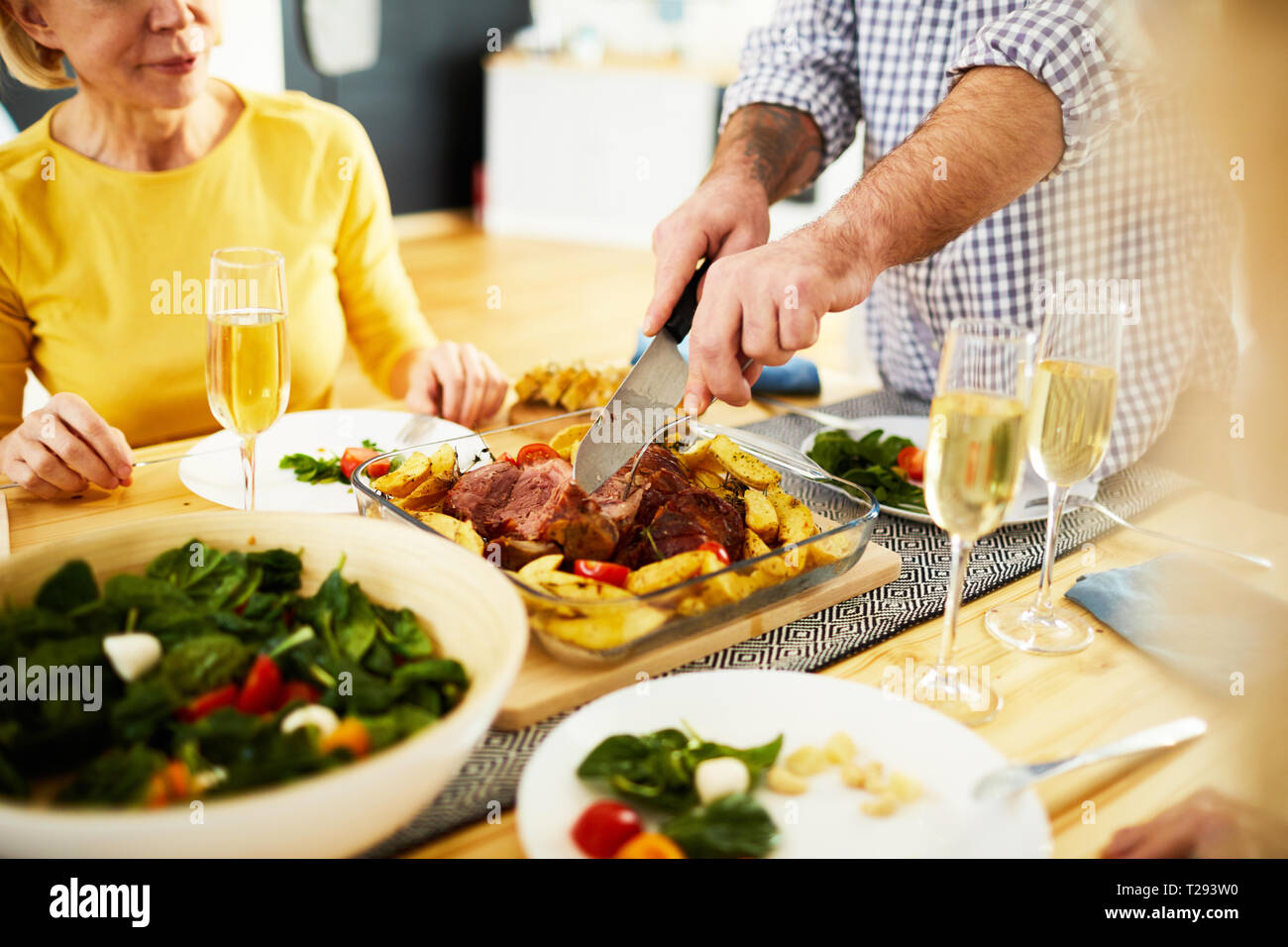Woman cutting meat dinner hi-res stock photography and images - Alamy