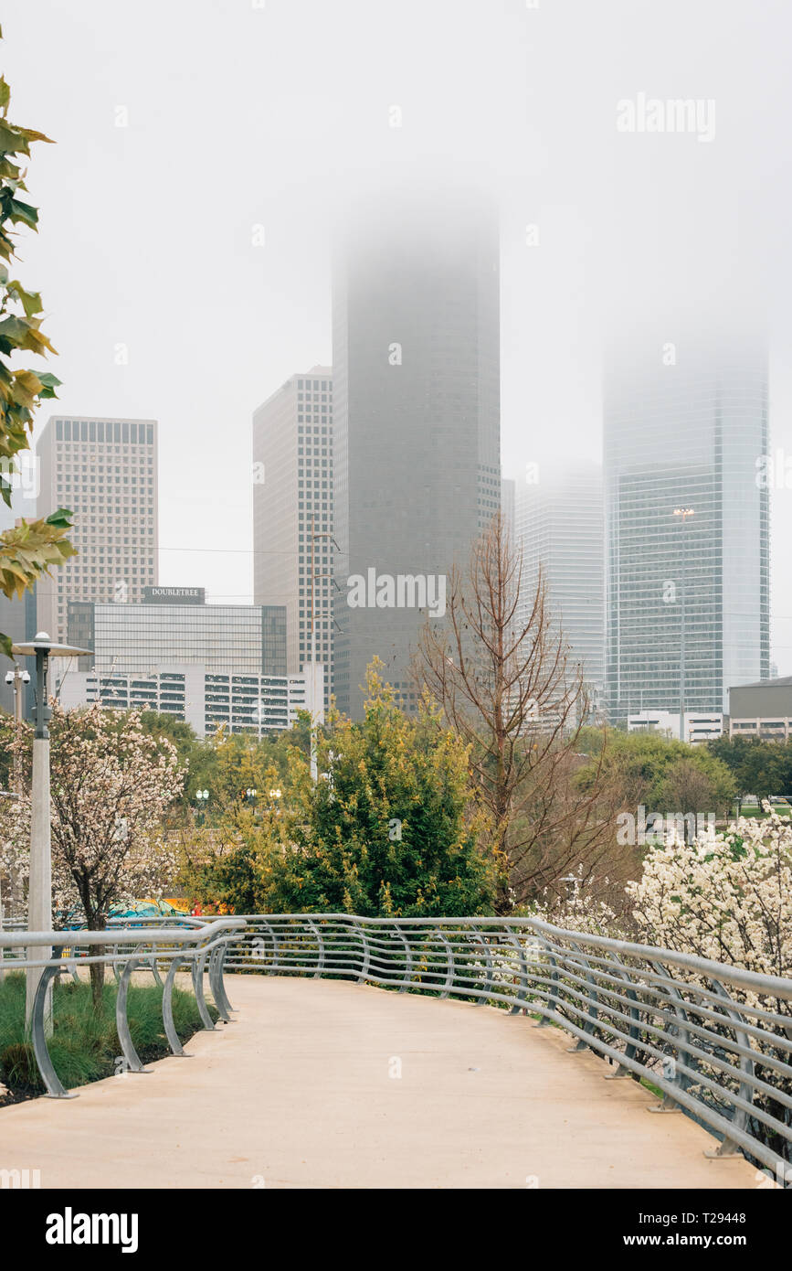 View of the Houston skyline in fog, from Buffalo Bayou Park in Houston ...