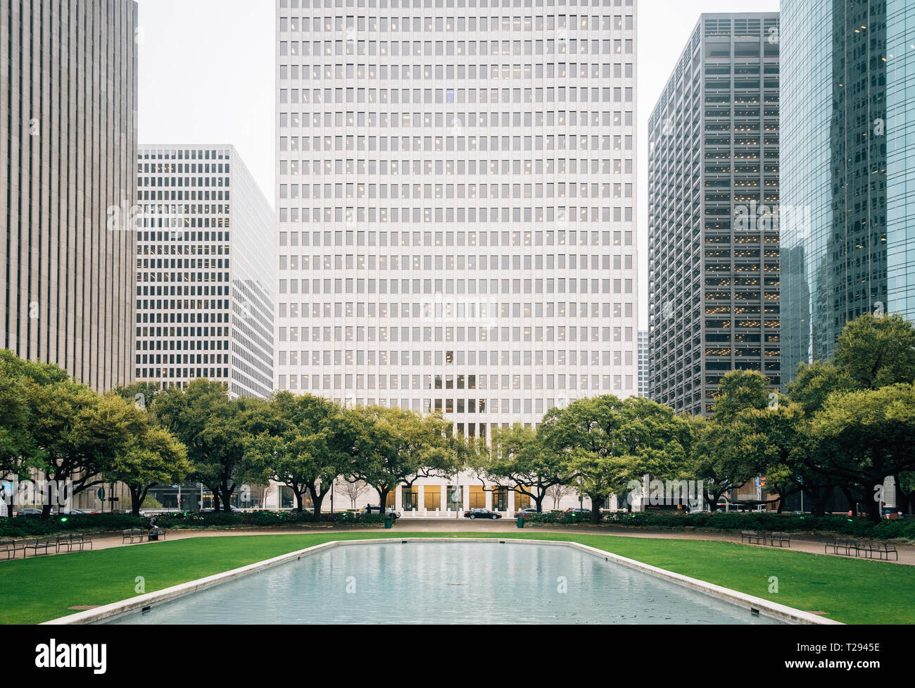 Reflecting pool at Hermann Square and modern buildings in downtown ...