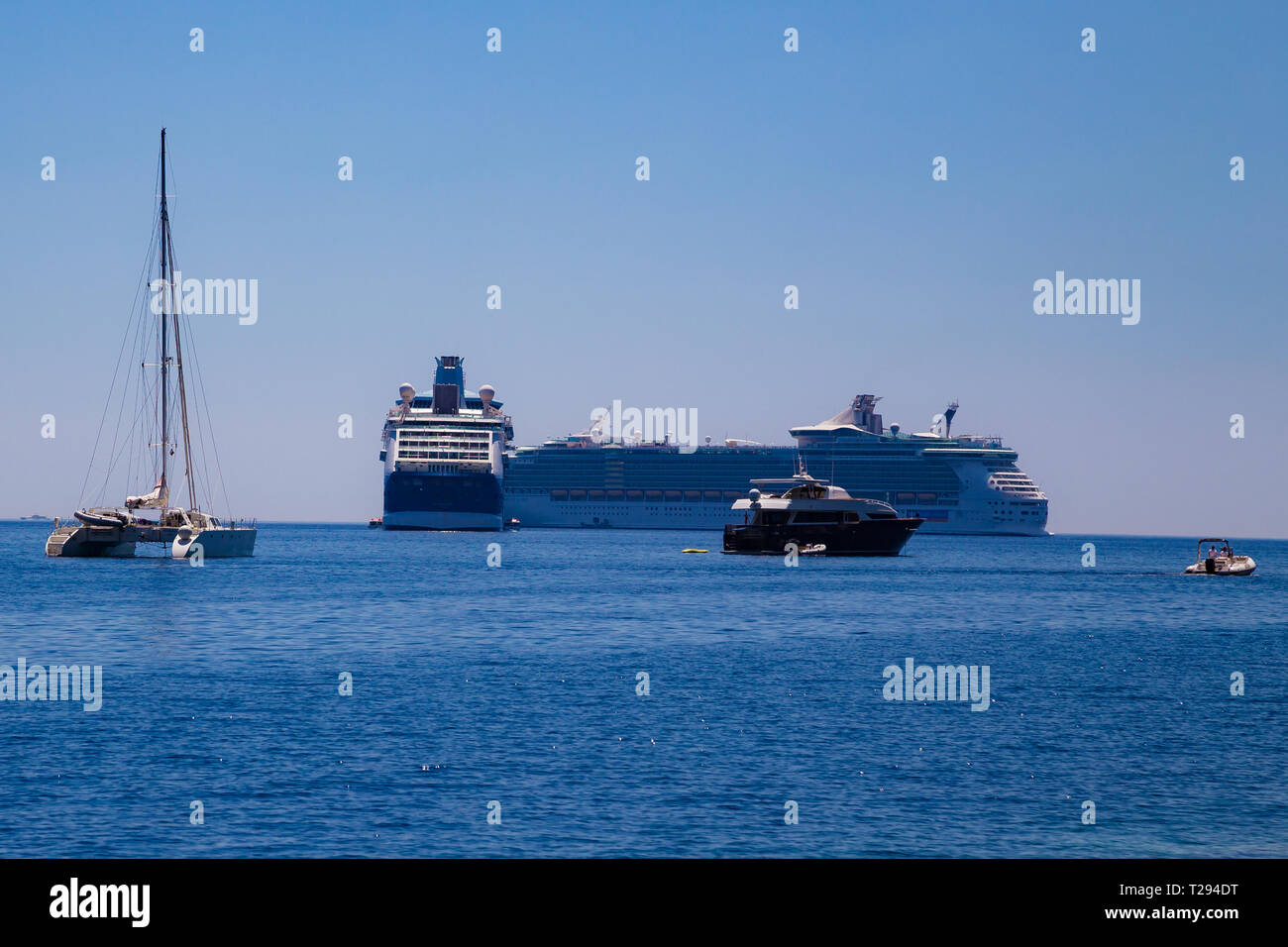 Two cruise ships and a twin hulled boat in the sea, Villefranche ...