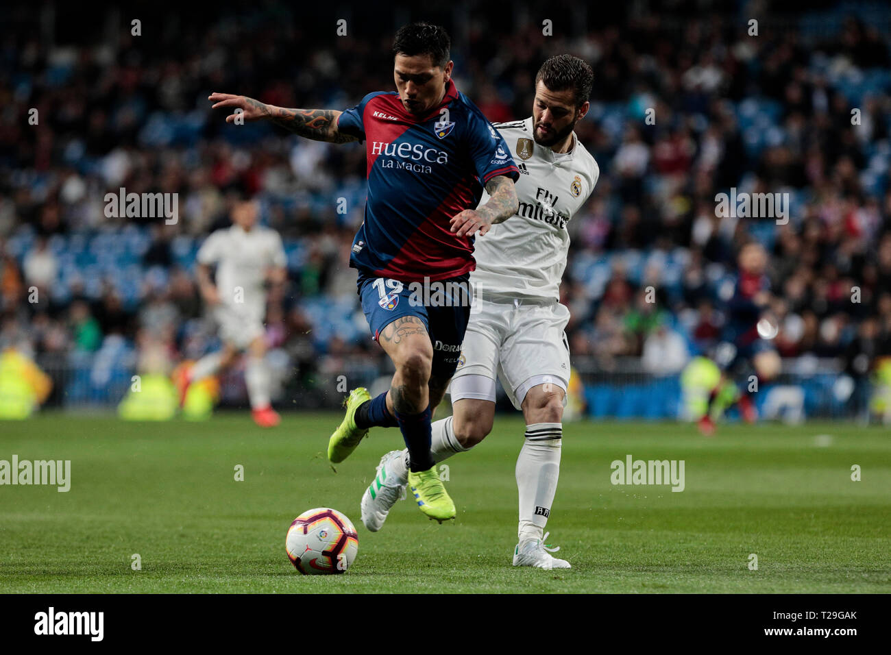 Real Madrid's Nacho Fernandez and SD Huesca's Luis Ezequiel 'Chimy ...