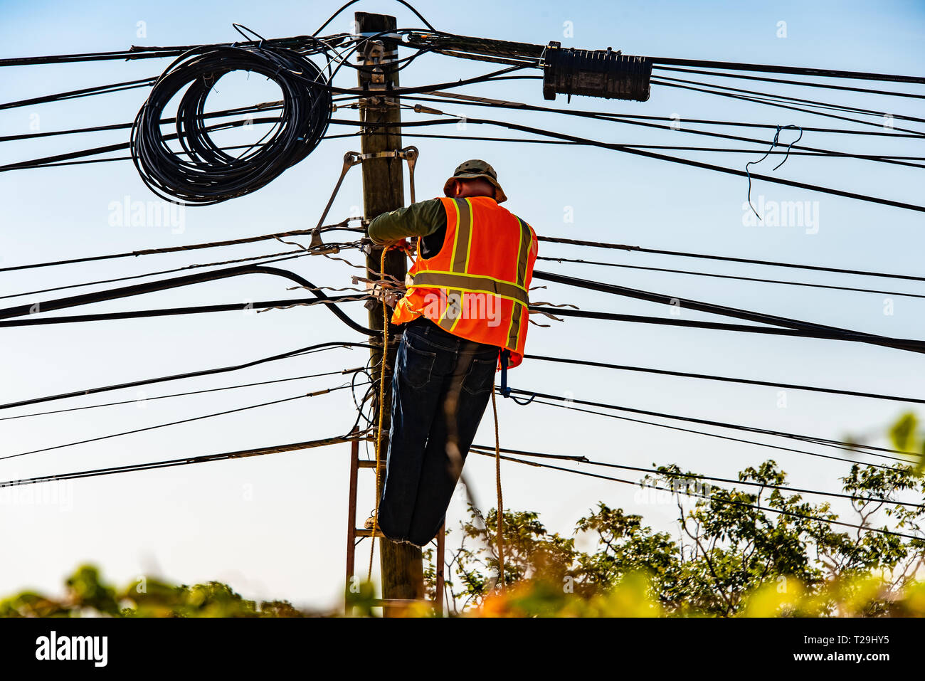 Lineman america pole hi-res stock photography and images - Alamy