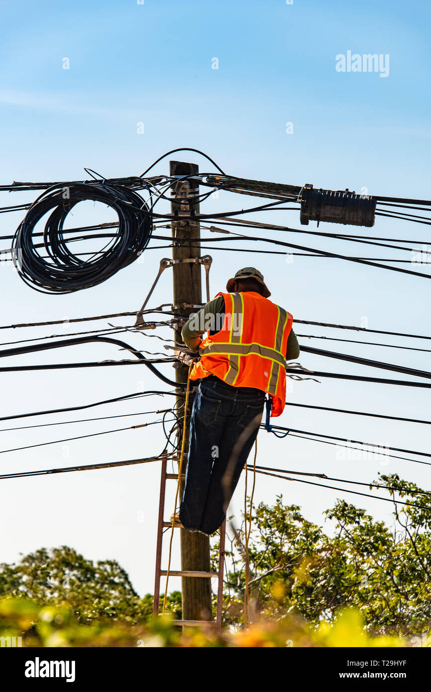 Electrical Lineman at work Stock Photo - Alamy