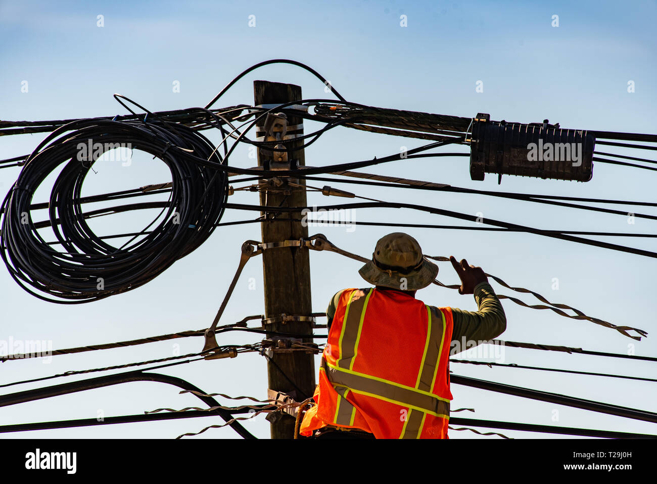 Electrical Lineman at work Stock Photo - Alamy