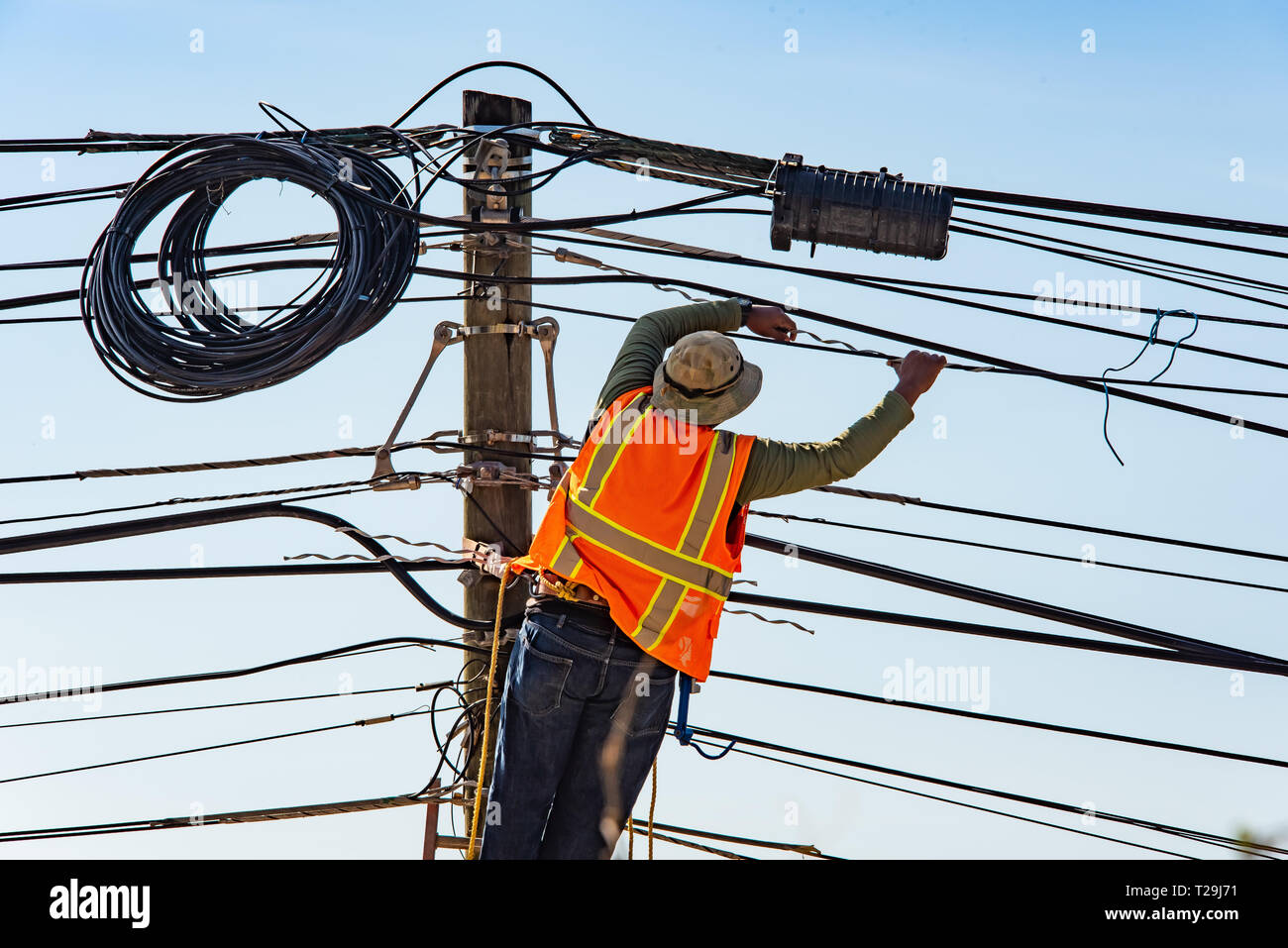 Electrical Lineman at work Stock Photo - Alamy
