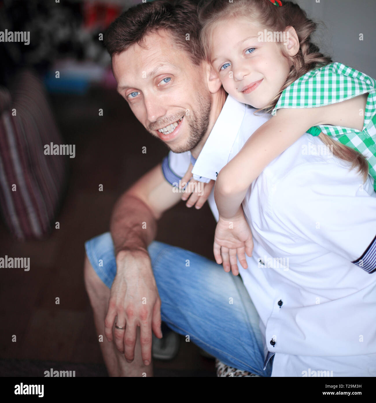 concept of raising children - a little girl hugging her beloved Stock ...