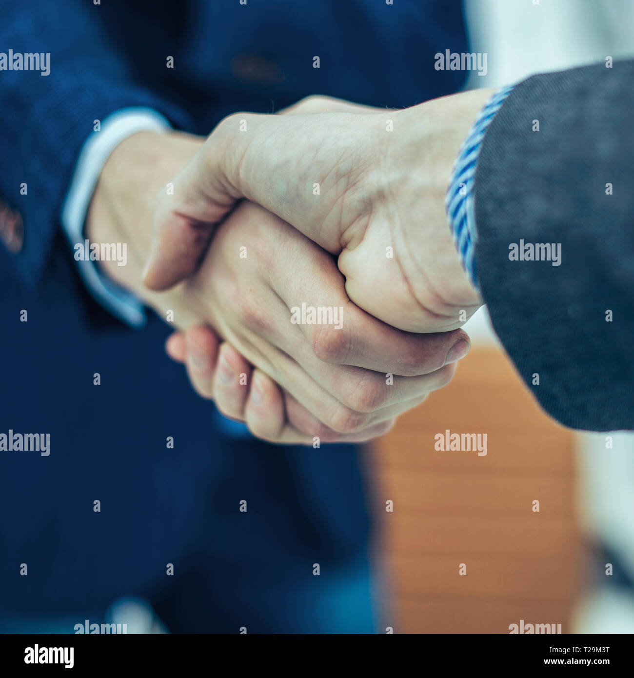 concept of partnership in business: a handshake of business part Stock ...