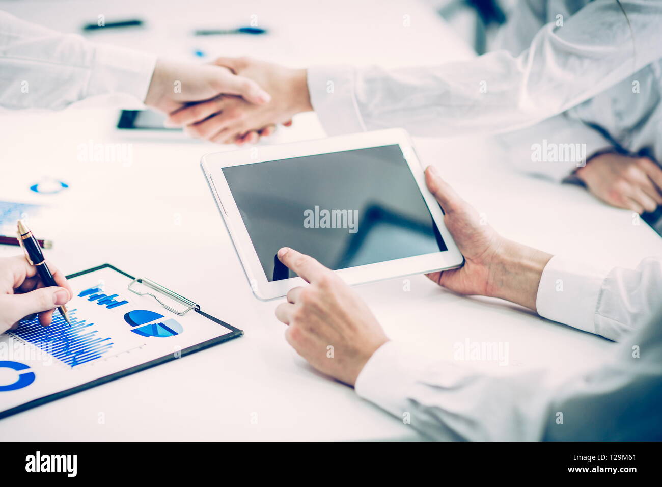 handshake Manager and client on a background of bright office .the ...