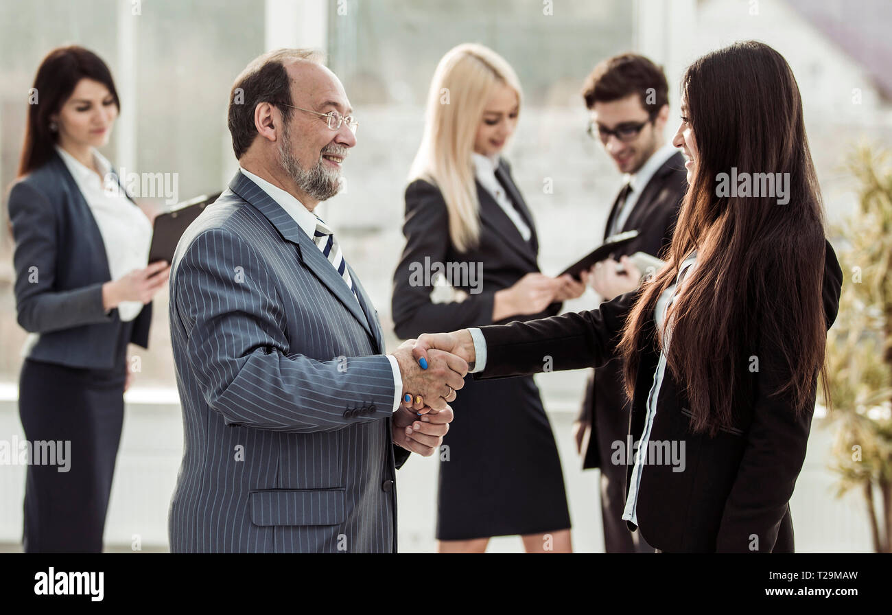welcome handshake between lawyer and client on the background of ...