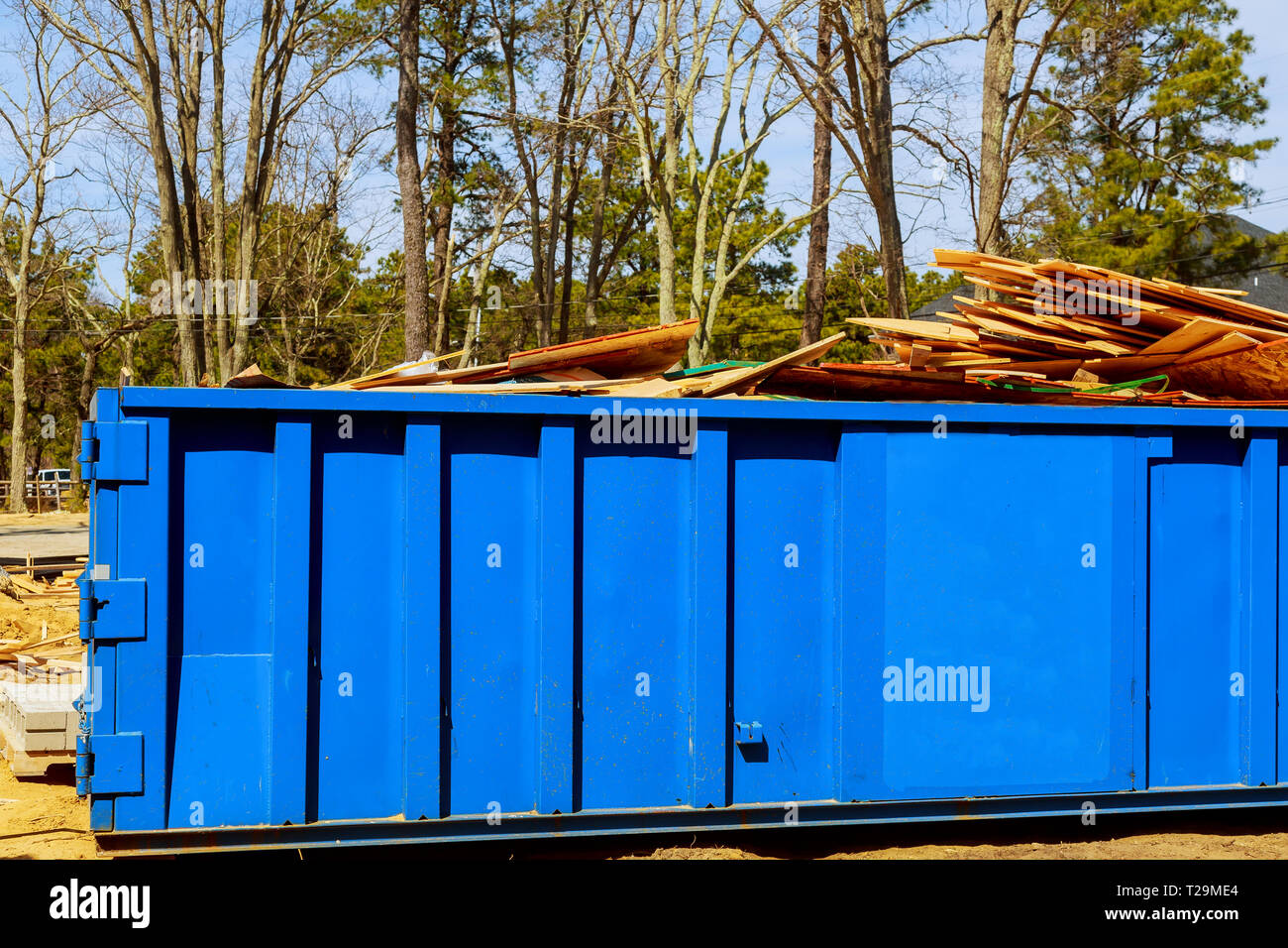 Dumpster, recycle waste and garbage bins near new construction of ...