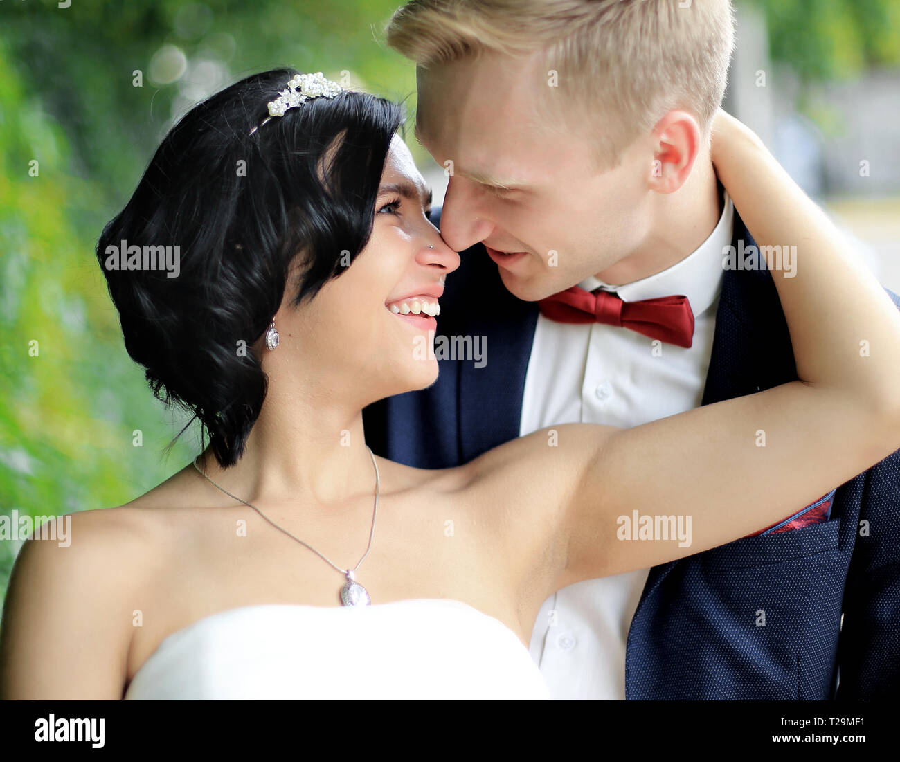 closeup. portrait of the bride hugging the groom Stock Photo - Alamy