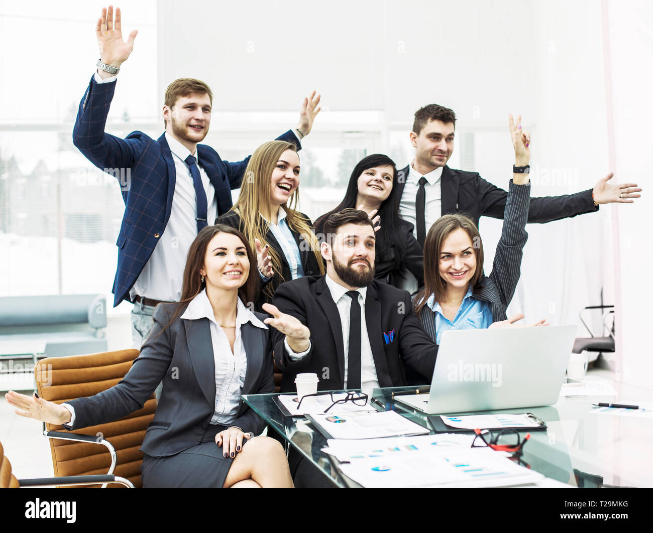 business team with their hands up and voting for decision-making near ...