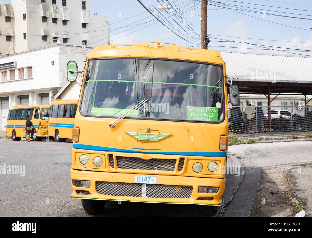 Yellow buses at the bus station in Bridgetown, the capital of Barbados ...