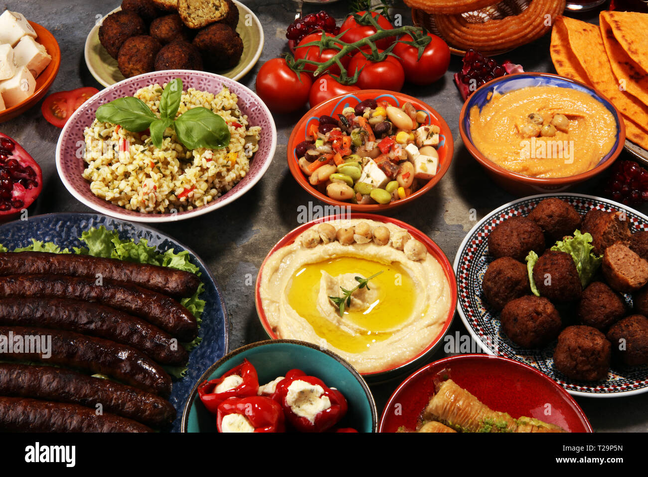 Middle eastern or arabic dishes and assorted meze, concrete rustic ...